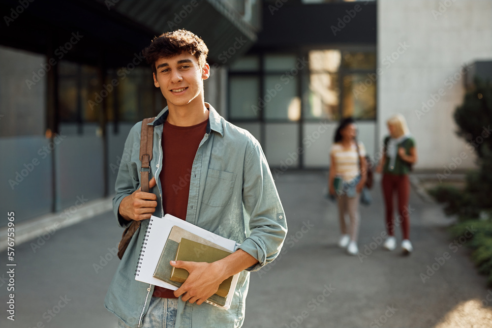 Portrait of male college student at campus looking at camera. Stock ...