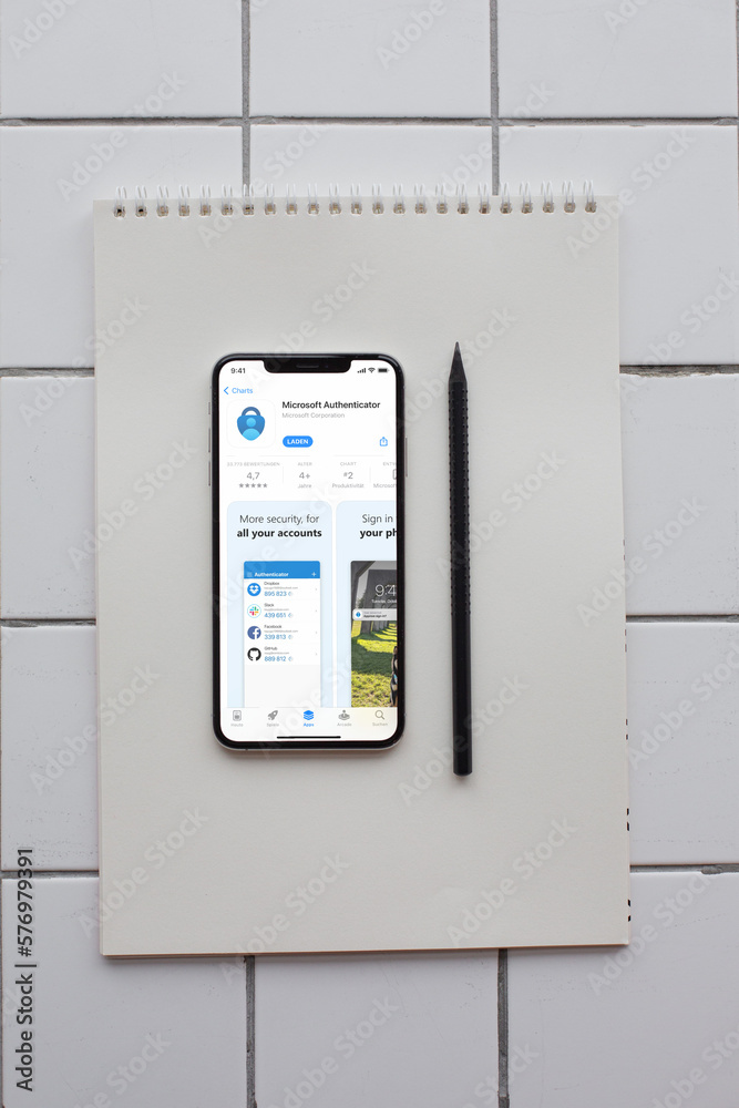 Mobile phone with Microsoft Authenticator App Store screen Stock Photo ...