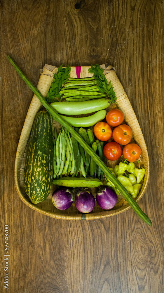Green Vegetables well arranged in a traditional moram made of palm ...
