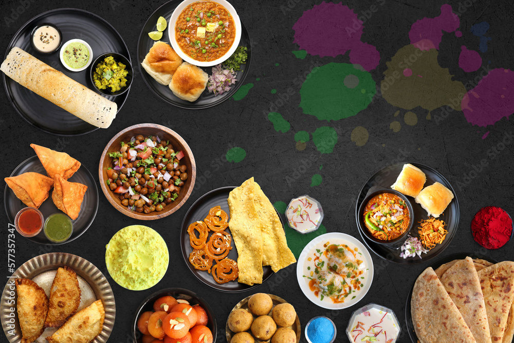 Assorted Indian Holi festival food like samosa, kachori, Puri bhaji ...