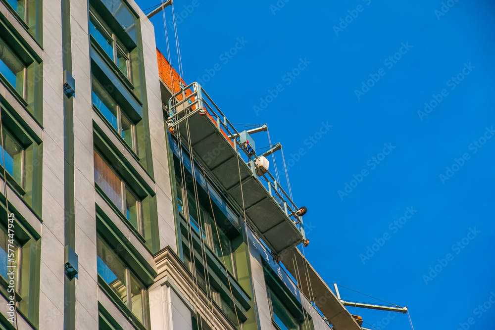Suspended platform, construction cradle hanging on building ...