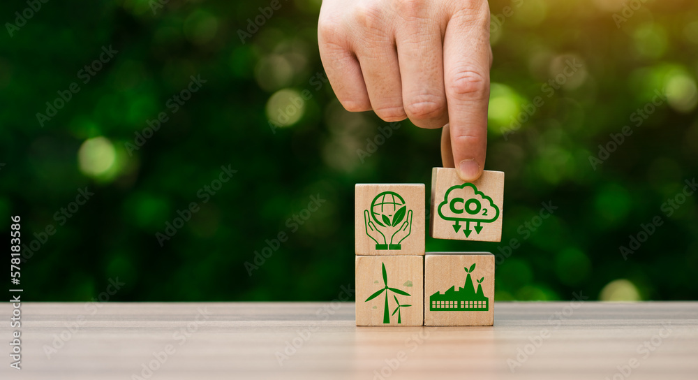CO2 emission reduction concept, businessman with environmental ...