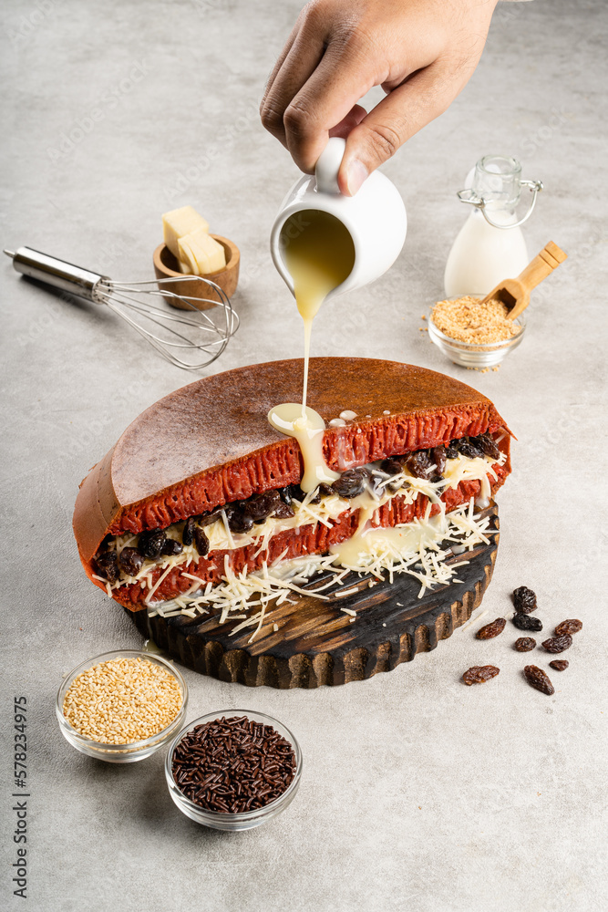 Martabak manis or terang bulan is indonesian sweet pancake, with red ...