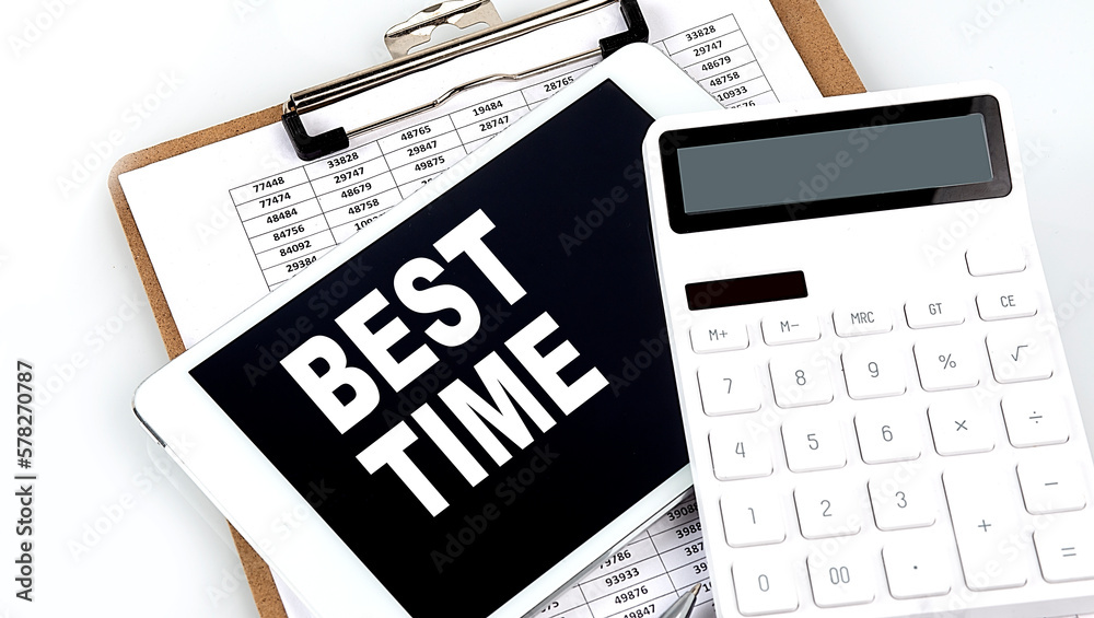 BEST TIME text on a tablet with chart, calculator and pen Stock Photo ...