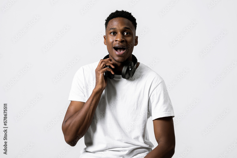 Photo Stock Surprised young african american black guy student emotional time by shows susprised ...