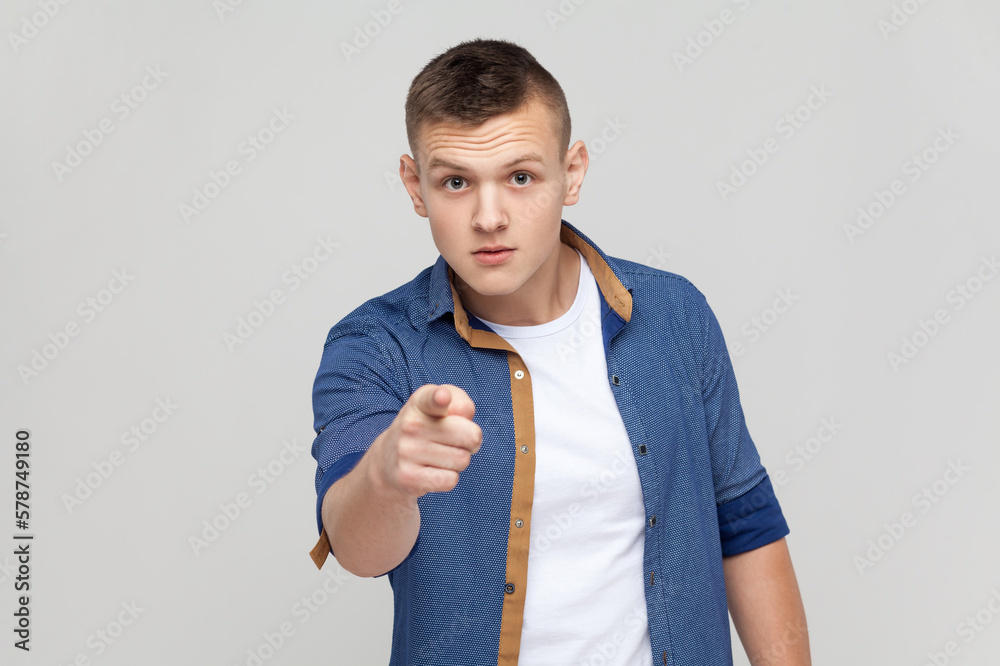 Teenager boy pointing finger at camera choosing you, scolding and ...