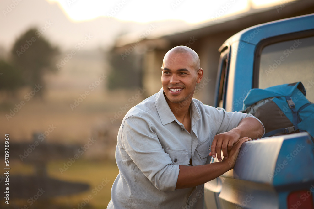 Portrait Of Man Loading Backpack Into Pick Up Truck For Road Trip To ...