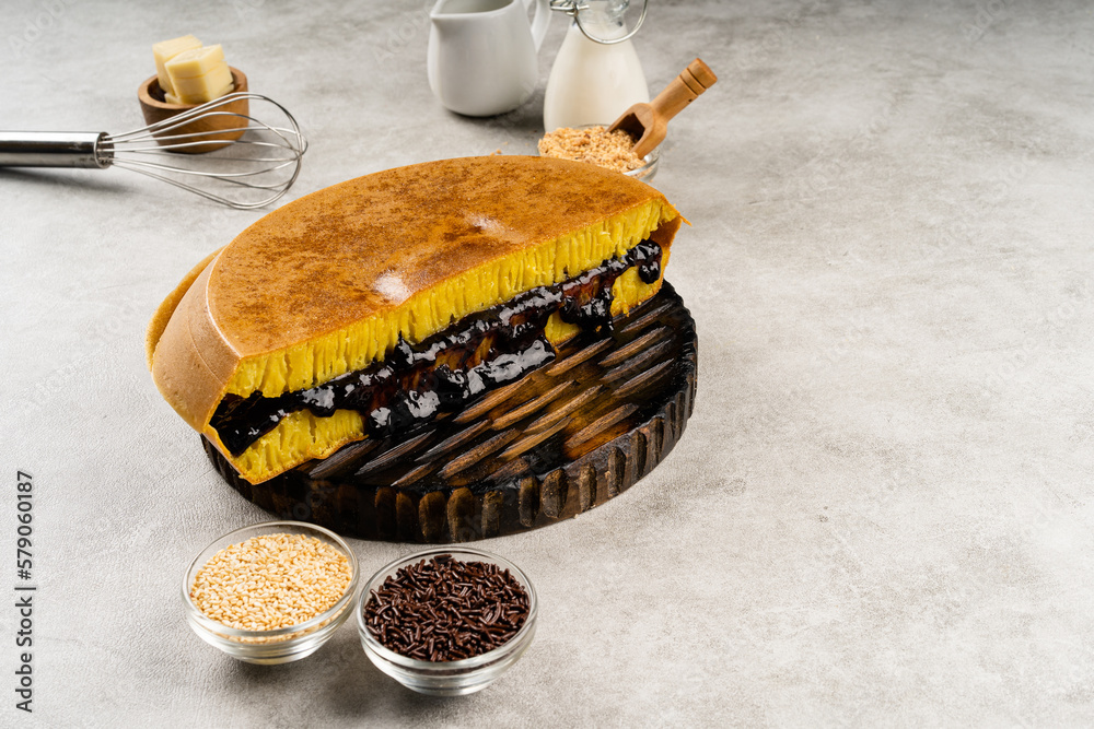 Martabak manis or terang bulan is indonesian sweet pancake, with yellow ...