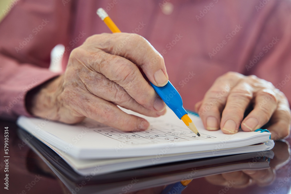 Close Up Of Senior Man With Arthritis Using Grip Aid On Pencil To Write ...