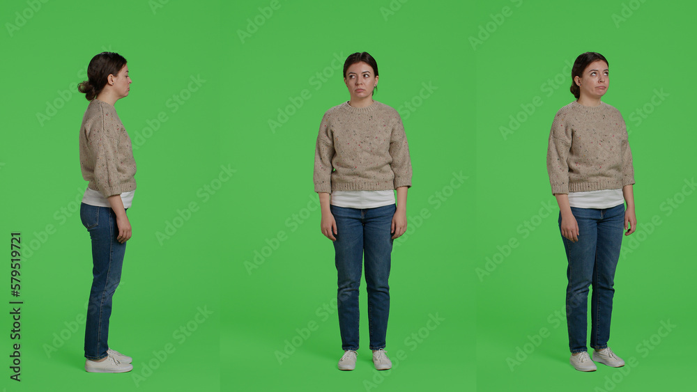 Stock-Foto „Sad displeased woman standing over full body backdrop with ...