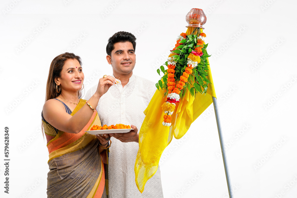 Indian Couple performing or celebrating Gudi Padwa Puja. celebrating ...