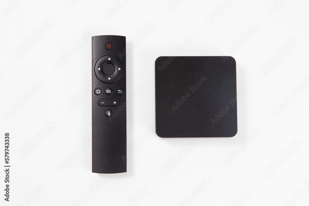 black multimedia TV box and remote controller Stock Photo | Adobe Stock