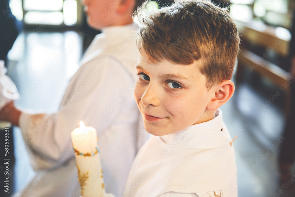 Stock-Foto „Little kid boy receiving his first holy communion. Happy ...