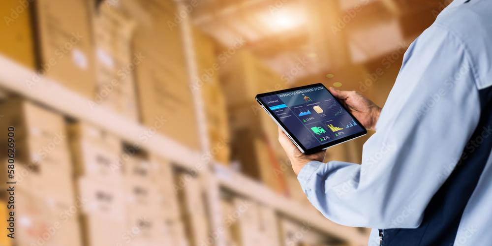 Smart Warehouse,Inventory management system concept.Manager using digital tablet,showing ...