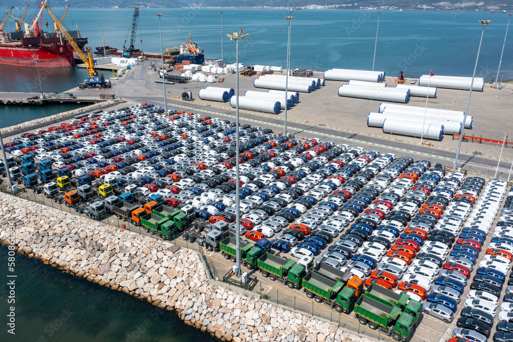 New assorted cars lined up in the port waiting to be loaded on the ro ...