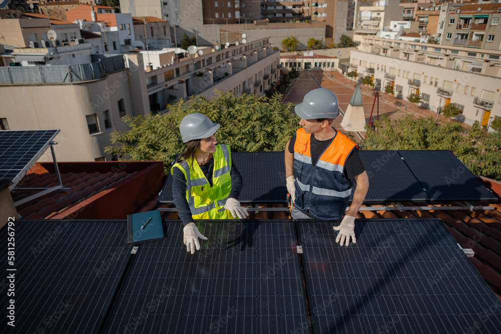 Top view, teamwork and engineers on solar roof for maintenance ...