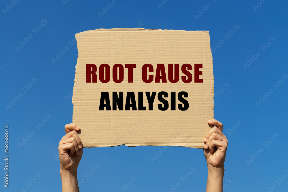 Root cause analysis text on box paper held by 2 hands with isolated ...