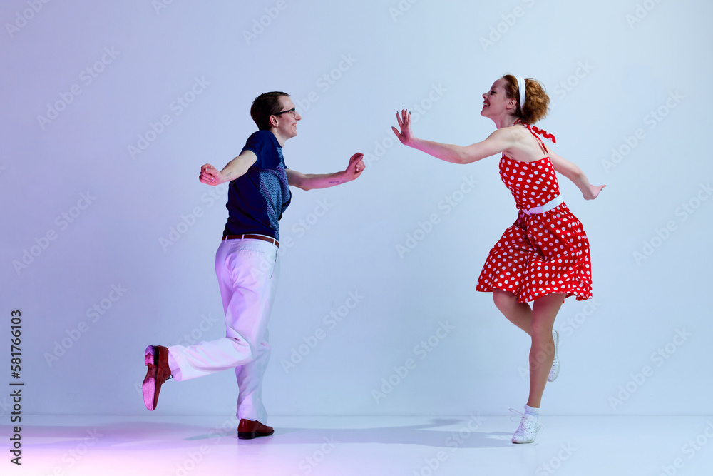 Retro dance styles. Young active couple, man and woman having fun ...