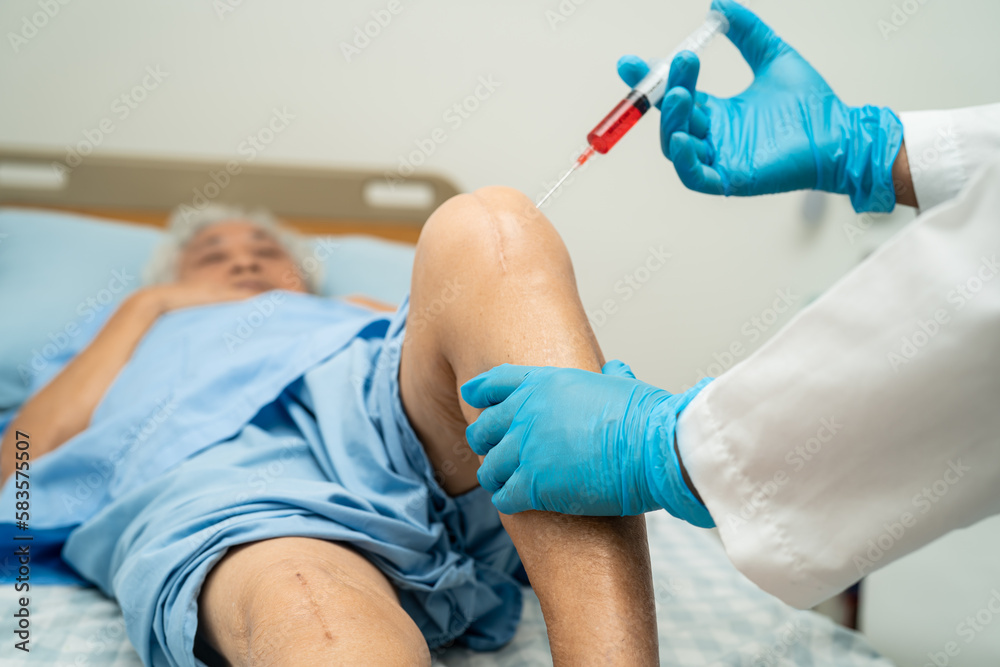 Asian doctor inject Hyaluronic acid platelet rich plasma into the knee ...