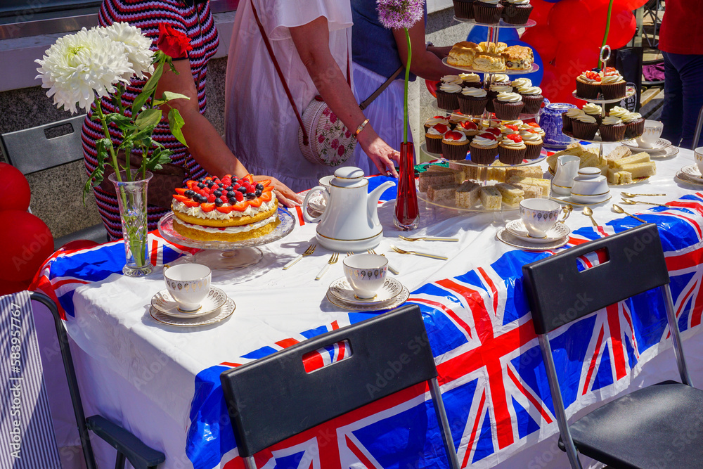 street party in the UK with tea and cakes. dressed table for royal ...