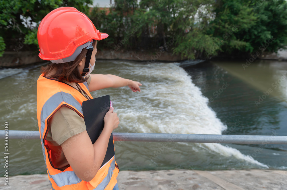 Asian Female engineering working . at sewage treatment plant,Marine ...