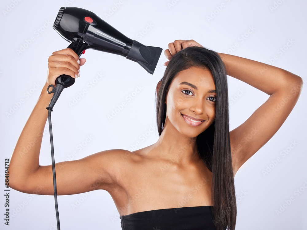 Indian woman, hair care or dryer in studio portrait for healthy natural ...