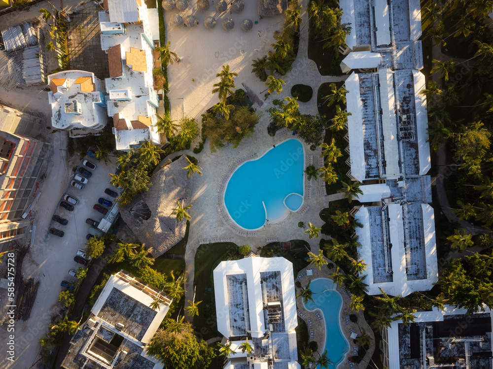 Top view of the resort town with swimming pools, palm trees, tall ...