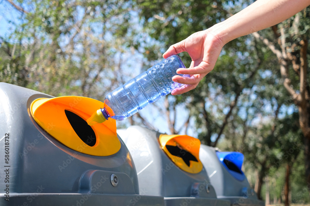 Please throw plastic bottles in the bin. Man littering the bins by ...