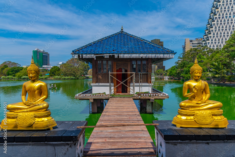 Golden buddha statues at Gangarama Seema Malakaya buddhist temple at ...