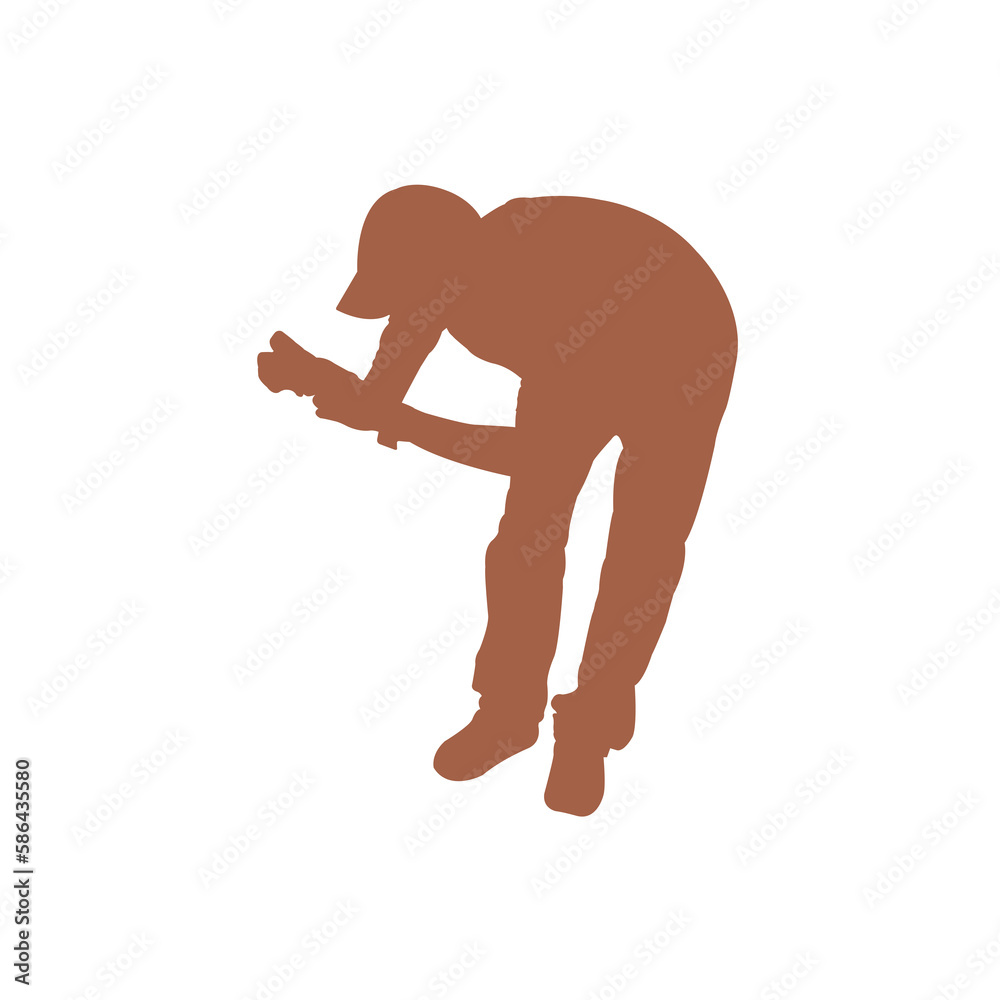 brown male photographer taking pictures bending down to take pictures ...