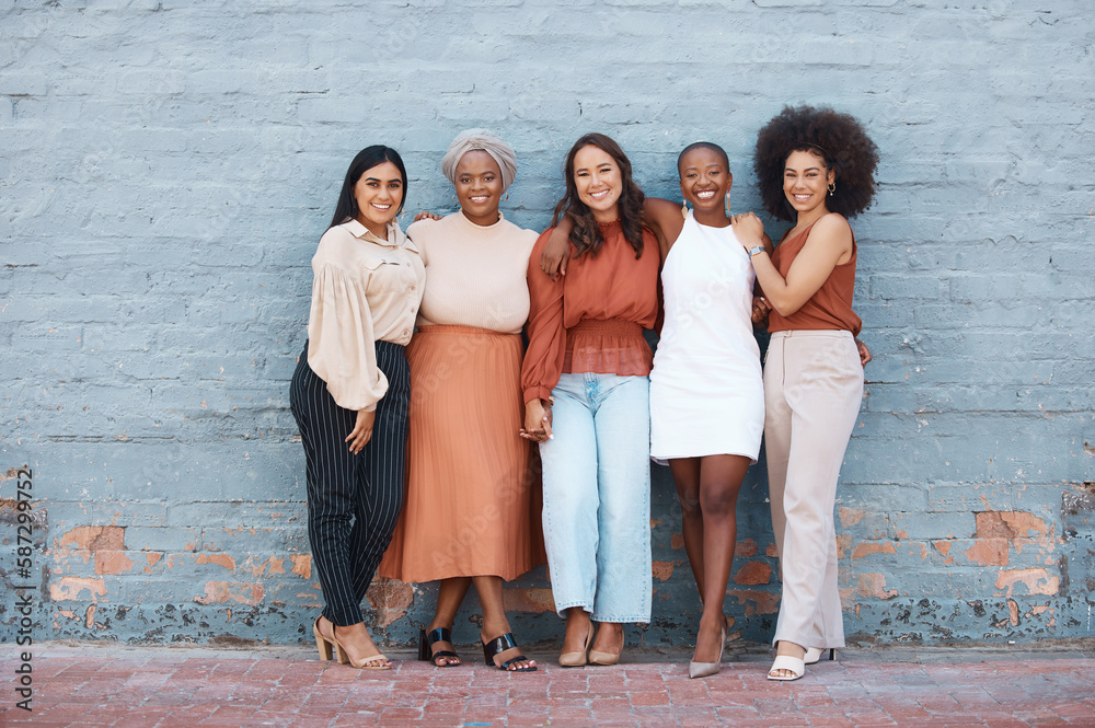 Portrait, group and business women smile standing on brick wall with ...