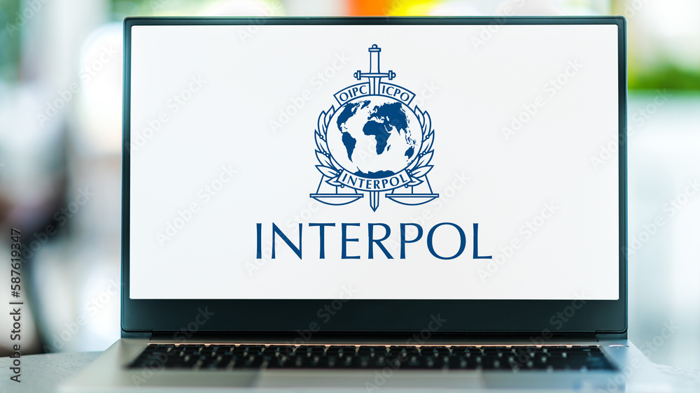 Laptop computer displaying logo of Interpol Stock Photo | Adobe Stock
