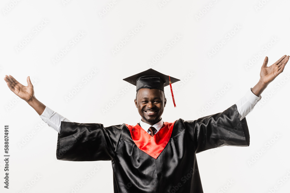 Photo Stock Happy african student in black graduation gown and cap ...