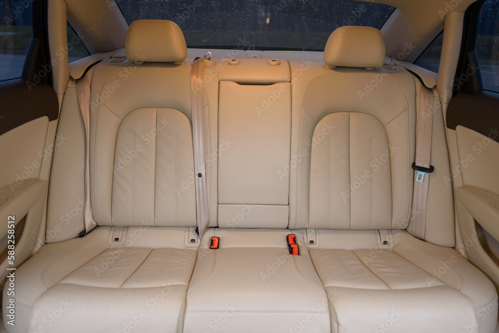 New car inside. Beige back seats in a sedan. Car cleaning theme. Luxury ...