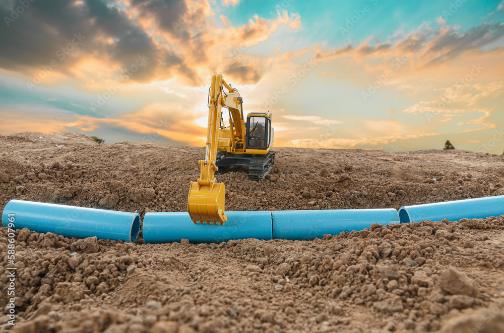 Crawler Excavator is digging in the construction site pipeline work in ...