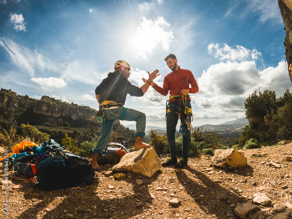 two people shaking hands in the middle of the mountain, friendship ...