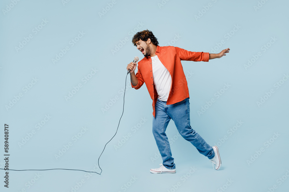 Full body side profile view happy young Indian man wear orange red ...