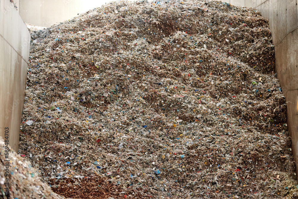 A pile of refuse-derived fuel (RDF) for combustion. Processing ...