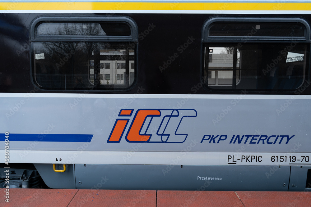PKP Intercity passenger train at railway station platform. Railroad car ...