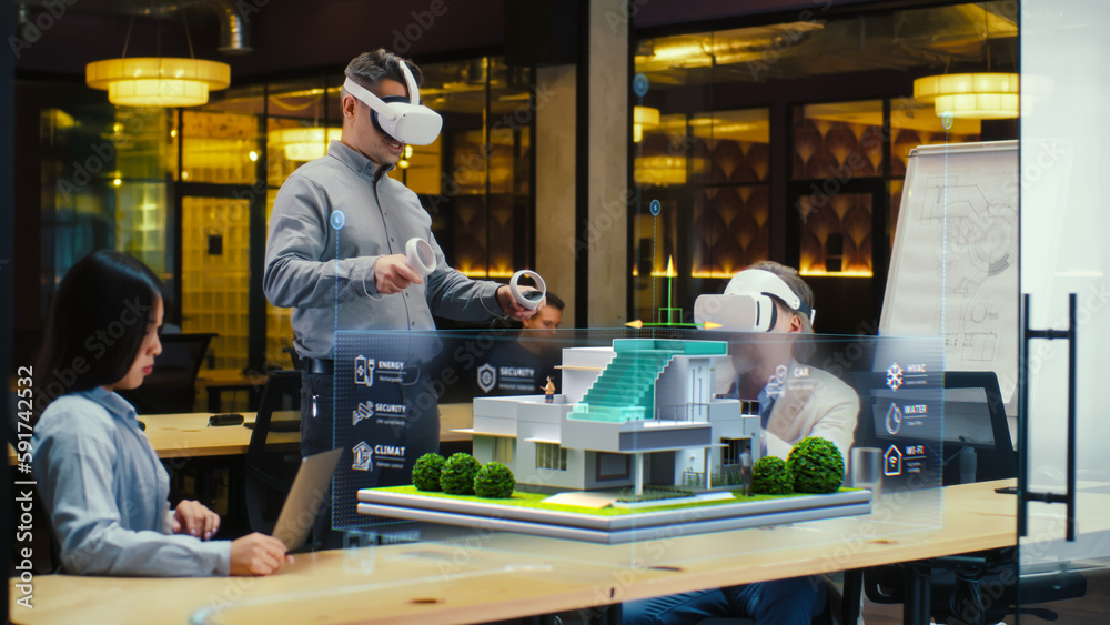 Male designer uses VR headset and wireless controllers, presents smart ...