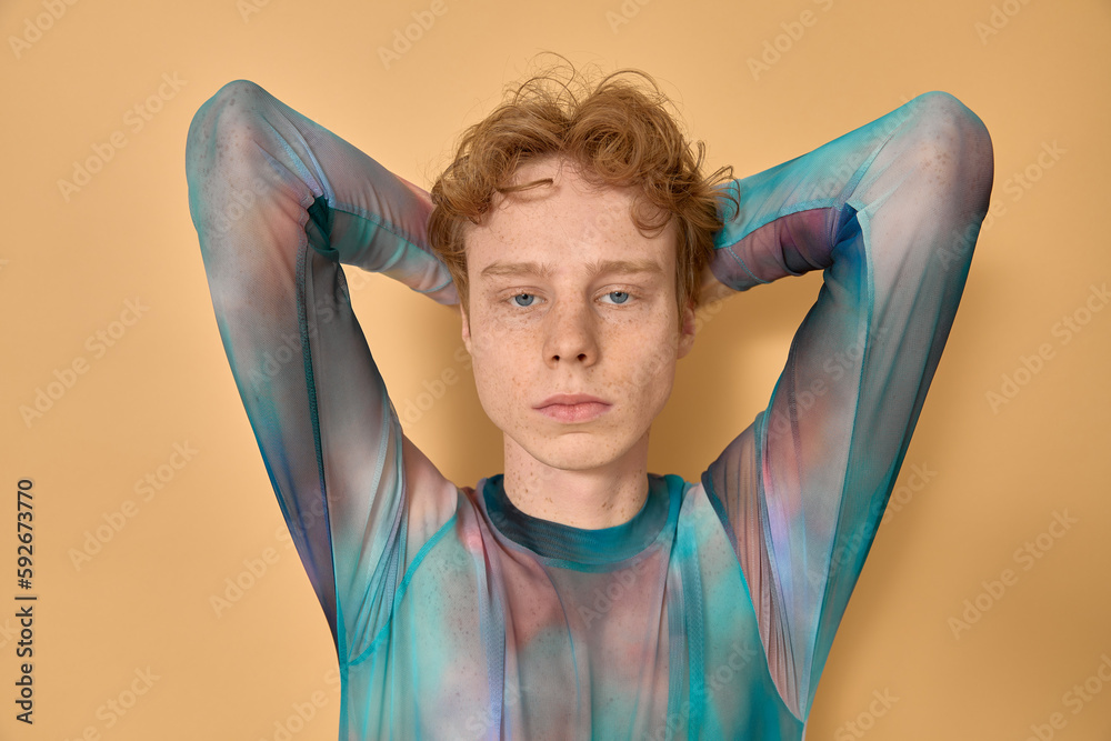 Portrait of very confident sexy androgynous ginger man fashion model ...