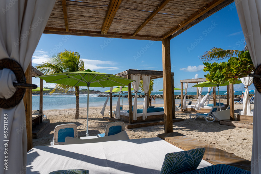 Beach cabanas overlooking the Caribbean Sea. Relax in the shade. Beach ...