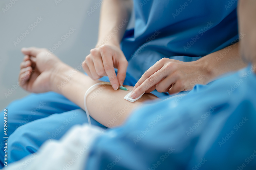 Doctor nurse took the syringe patient One hand take a cotton swab ...