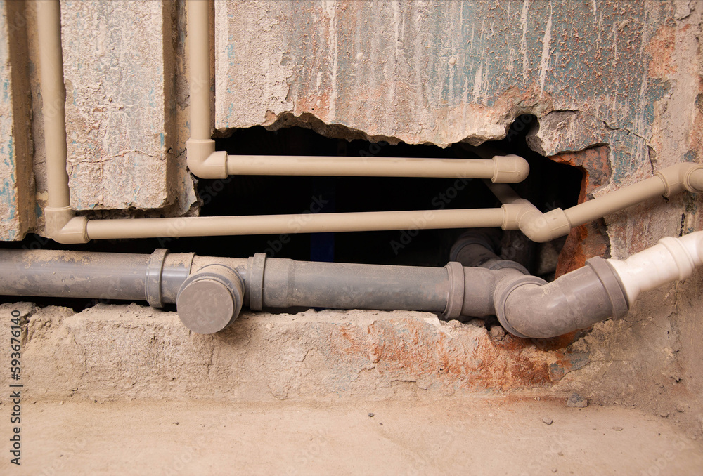 Transfer of water pipes and sewerage drain in the wall. Bathroom ...