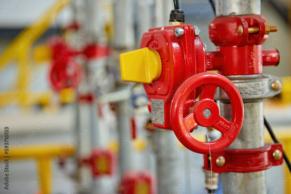 Red fire water valve on the piping system of the industrial ...