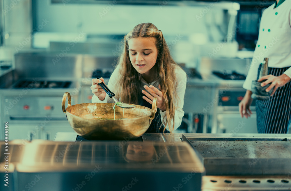 Photo Stock In culinary school, teenager learn from real chefs how to ...