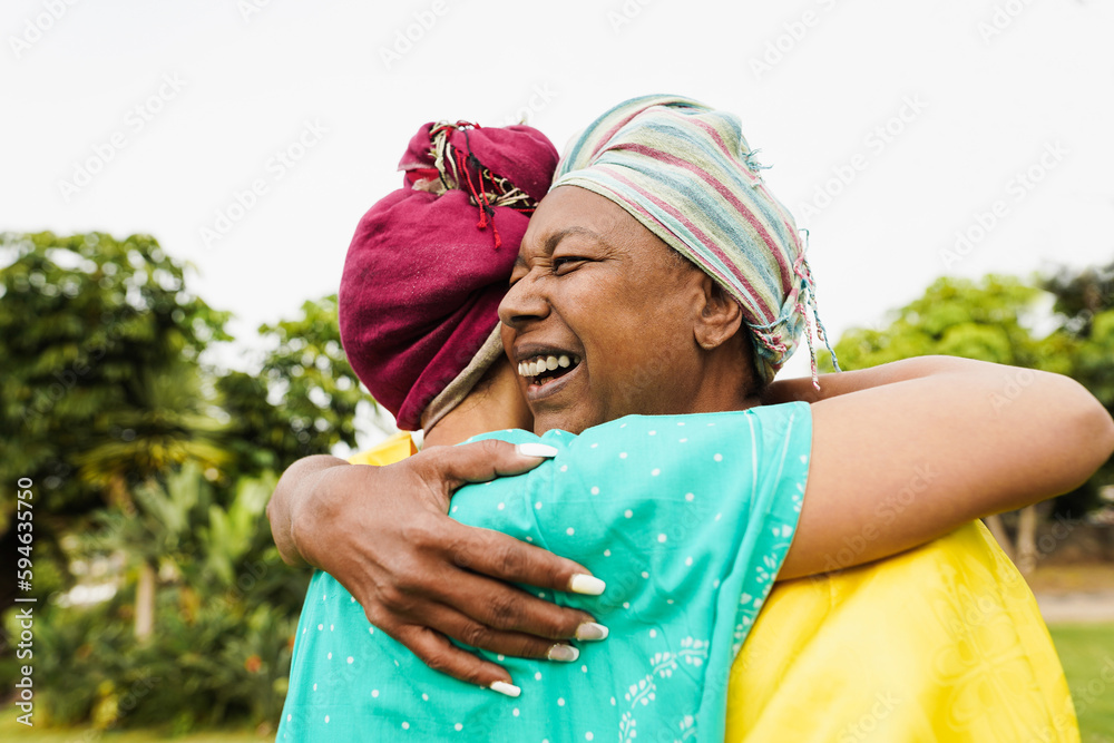 African women hugging each others outdoor - Afro mother and daughter ...