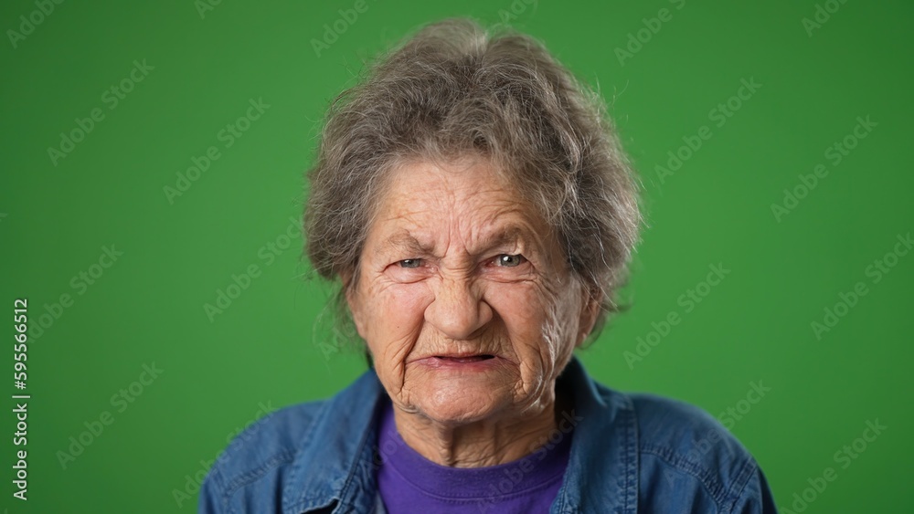 Portrait of toothless, angry upset frustrated elderly senior old woman ...