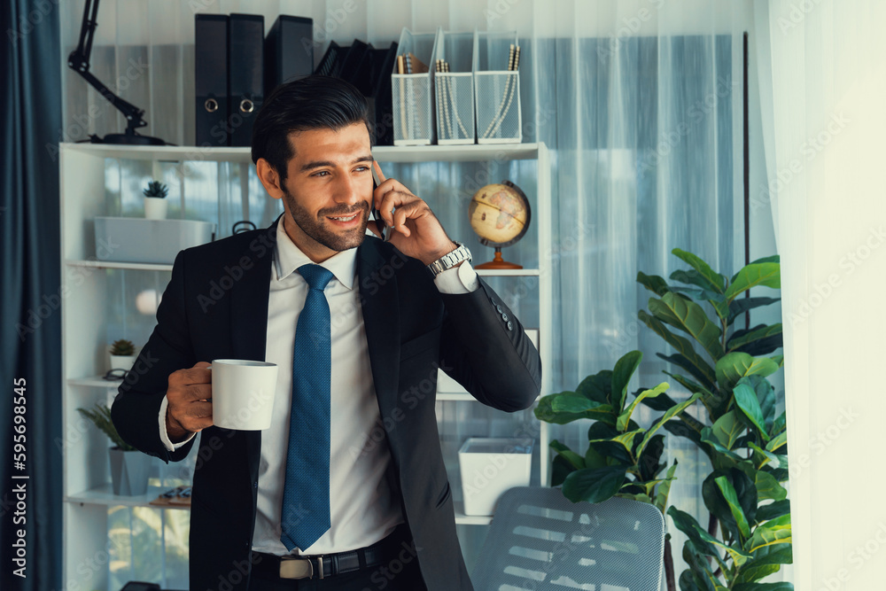 Diligent and busy businessman talking on phone call with coworker in ...