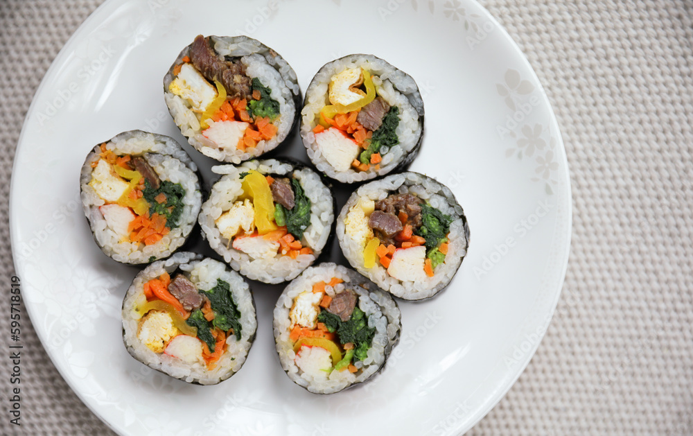 Kimbap is a traditional Korean dish made of rice, vegetables, and meat ...